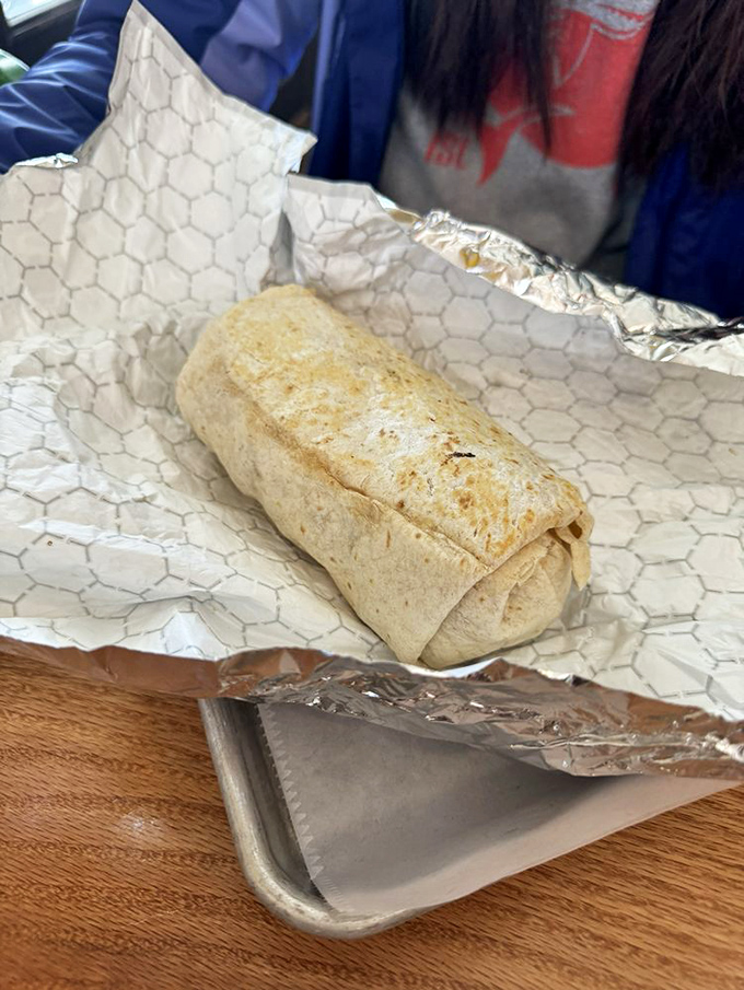 This burrito has been wrapped with the care of a newborn baby. Inside awaits a treasure of morning flavors just waiting to be discovered.