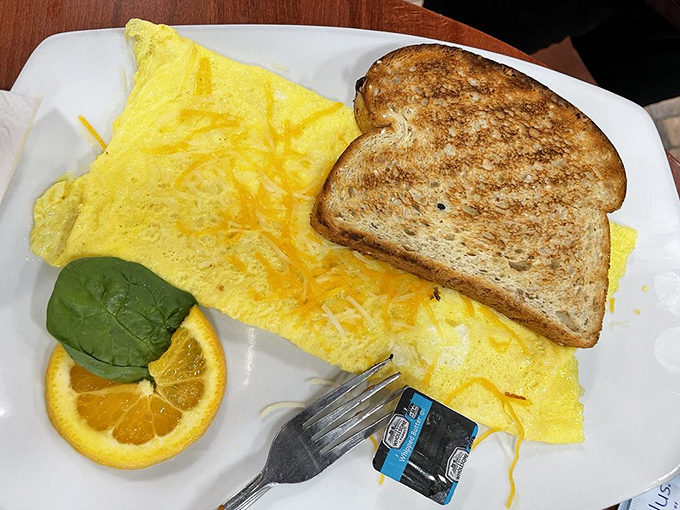 Fluffy eggs folded over melted cheese with perfectly browned toast—sometimes the classics become classics because they're simply unbeatable.