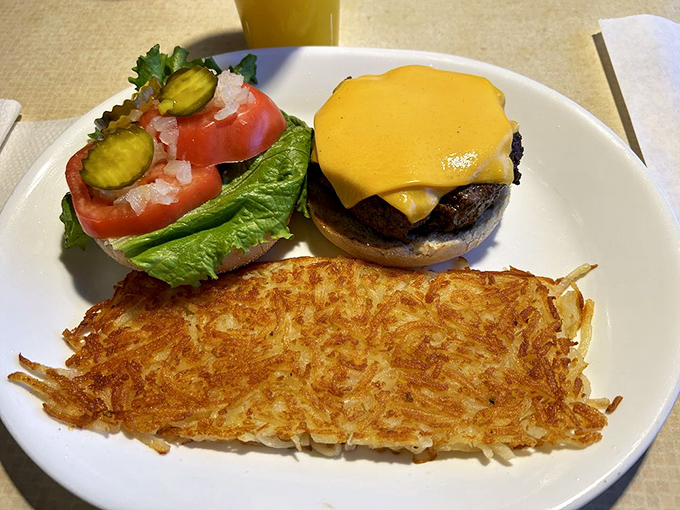 This isn't just a burger&mdash;it's breakfast's afternoon cousin stopping by for a visit. Those hash browns are the crispy golden welcome mat we all deserve.