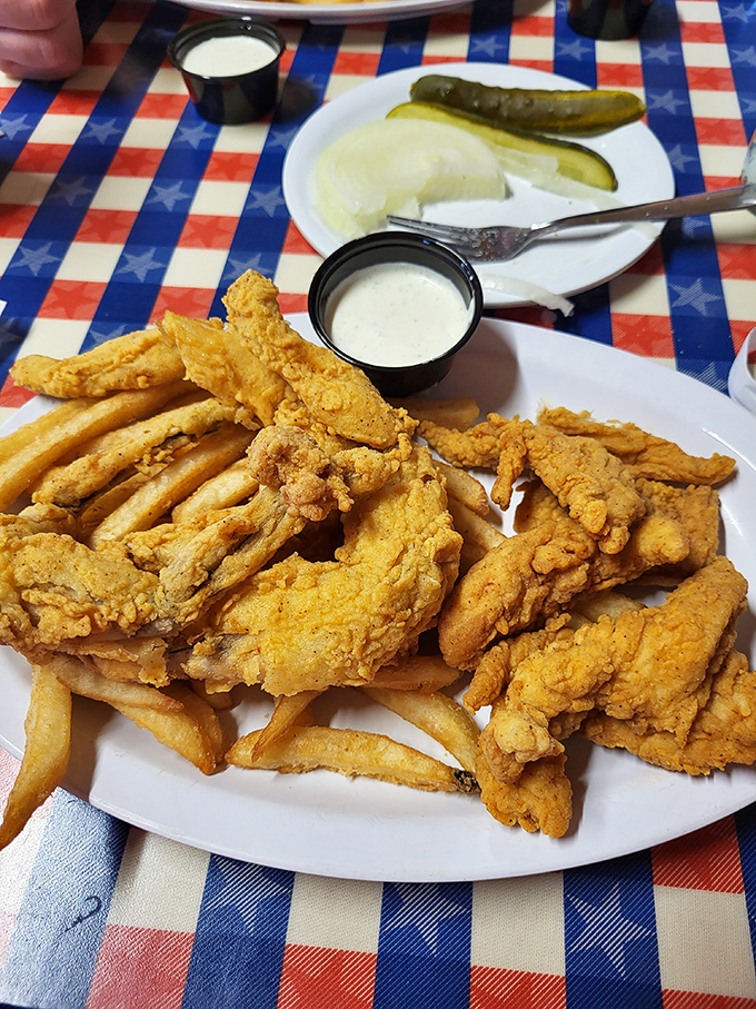 Chicken tenders that redefine the genre&mdash;juicy inside, audibly crunchy outside, served with pickles that cut through the richness like a well-timed punchline.