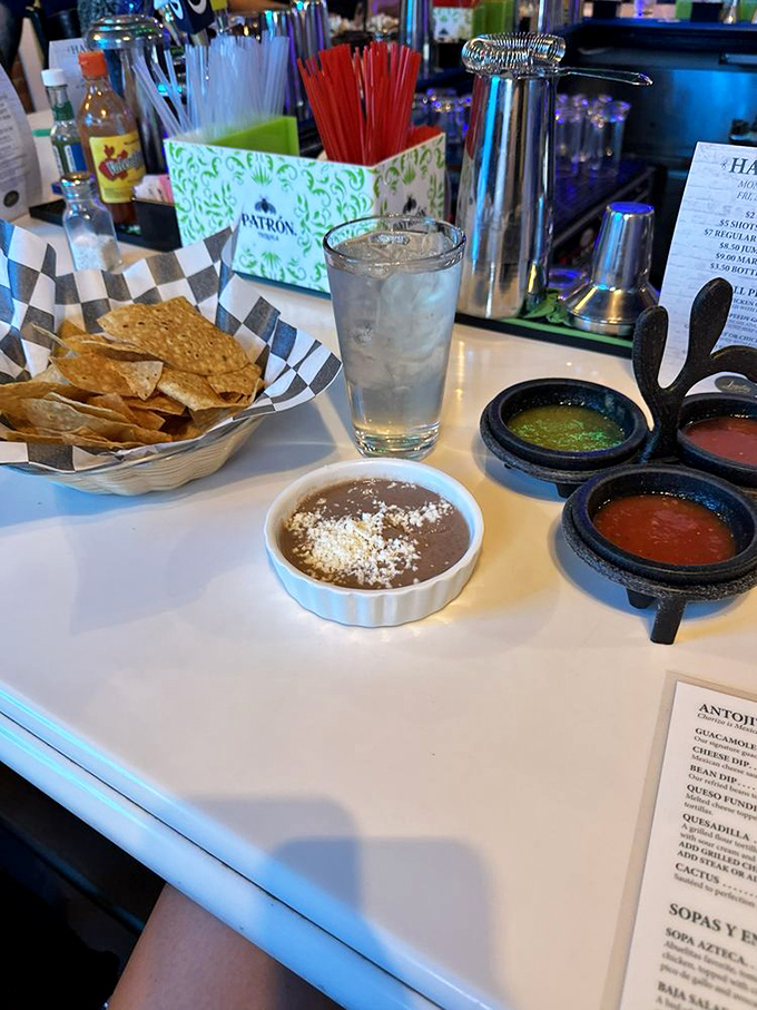 The holy trinity of Mexican starters: fresh chips, house-made salsas, and beans dusted with cheese. The meal hasn't even begun, and you're already in heaven.