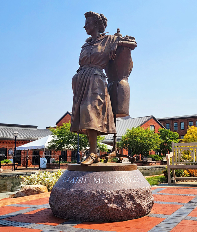 Claire McCardell's statue honors Frederick's fashion revolutionary. This bronze tribute celebrates the woman who freed American women from restrictive clothing and introduced practical elegance.