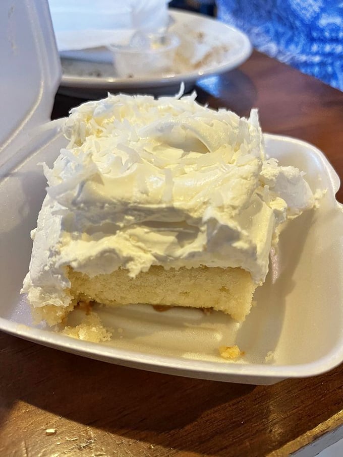 The coconut cream cake doesn't need fancy presentation&mdash;just a plastic fork and your undivided attention. Save room or regret it forever.