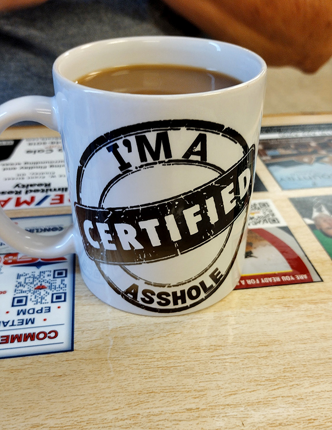 The coffee mug speaks the unvarnished truth&mdash;a perfect match for a diner where authenticity trumps pretense every time.