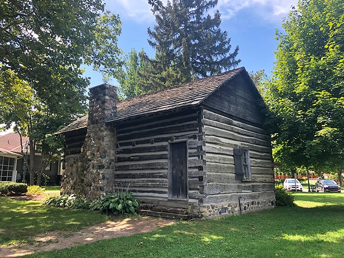 The historic Comstock Cabin offers visitors another glimpse into Michigan's past, complementing the castle's more fanciful architecture.