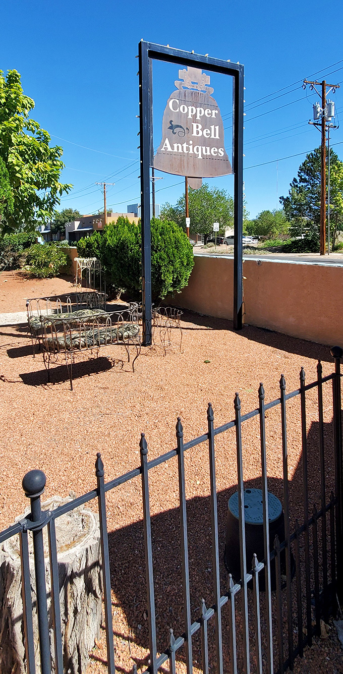 Copper Bell Antiques announces itself with desert simplicity&mdash;that bell sign promising to ring in vintage discoveries behind the gate.