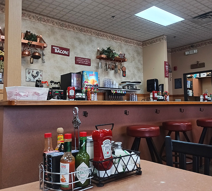 The counter where breakfast dreams come true, complete with the obligatory condiment caddy for hot sauce enthusiasts and ketchup devotees.