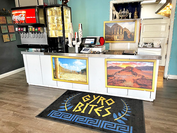 The counter where dreams come true. Those framed Mediterranean landscapes aren't just decoration&mdash;they're a preview of your taste buds' destination.