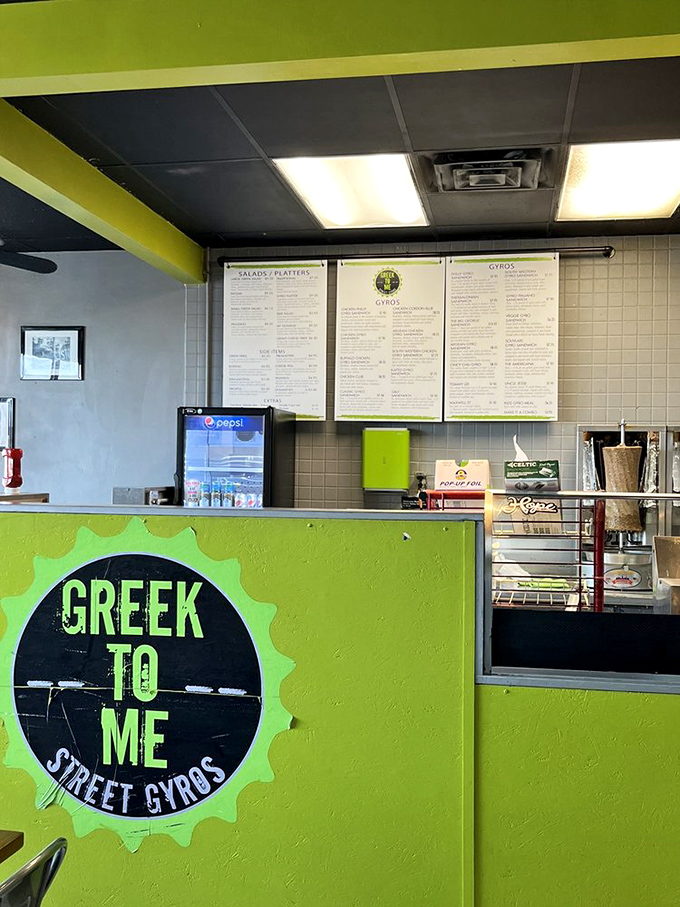 The lime-green counter announces "this isn't your yia-yia's formal Greek restaurant"&mdash;it's where street food meets Kentucky convenience.