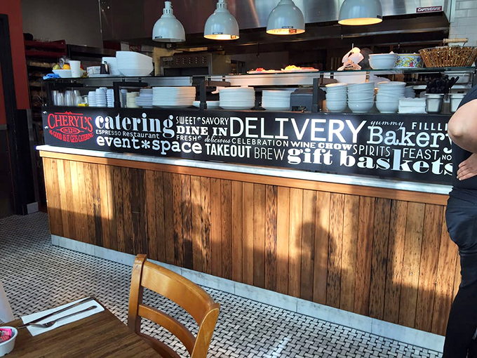 The market counter showcases Cheryl's dual identity—part restaurant, part gourmet shop, all delicious.