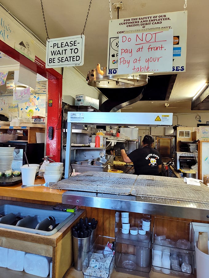 Signs that tell you exactly how things work here: no fuss, no muss, just the straightforward approach that makes diners the last honest restaurants in America.