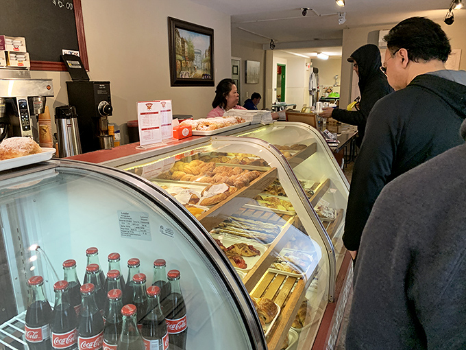 Behind the counter, where the magic happens: wooden boards showcase treasures that make you wonder if you could reasonably order one of everything. 
