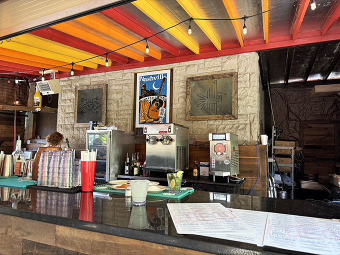 The bar area combines rustic stone, colorful ceiling beams, and Nashville charm&mdash;a perfect backdrop for margarita-fueled conversations about life.