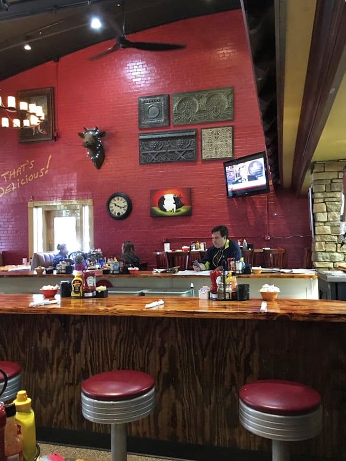 The counter seating offers front-row tickets to the breakfast theater, where every sizzle tells a story.