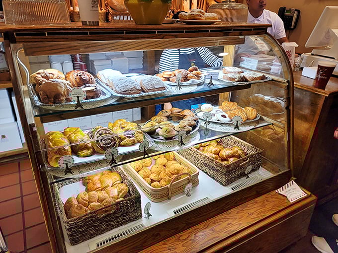 The pastry case: where willpower goes to die and "I'll just have one" becomes the day's most ambitious fiction.