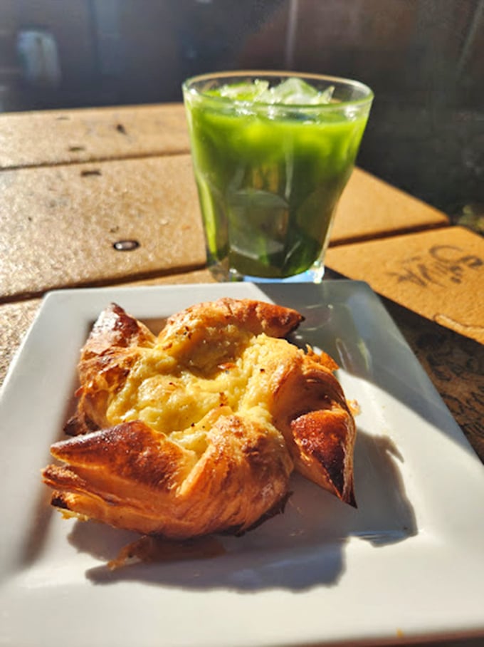 Morning glory: a golden Danish alongside vibrant matcha, proving that breakfast can indeed be both beautiful and delicious.