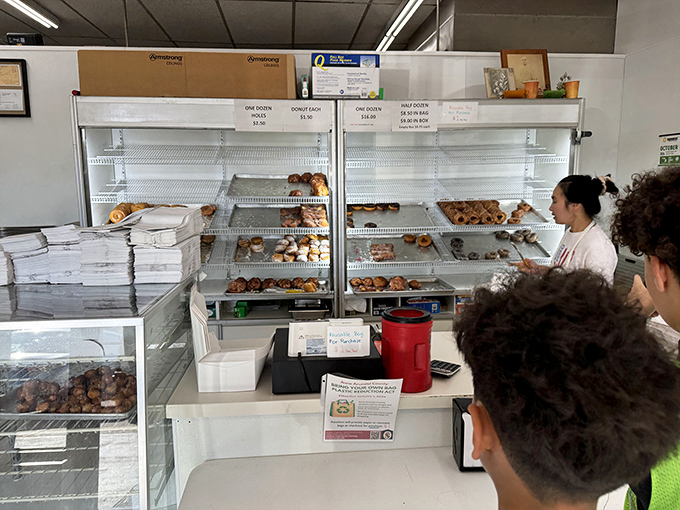 The morning pilgrimage to Carlson's &ndash; where patience is rewarded with fried dough perfection and the line moves with practiced efficiency.