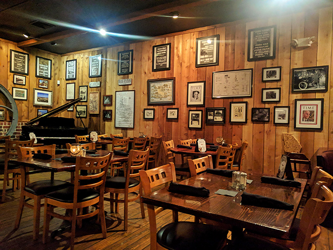 The gallery wall of memories tells you this isn't some corporate chain's idea of atmosphere&mdash;it's genuine Georgia hospitality preserved in picture frames.