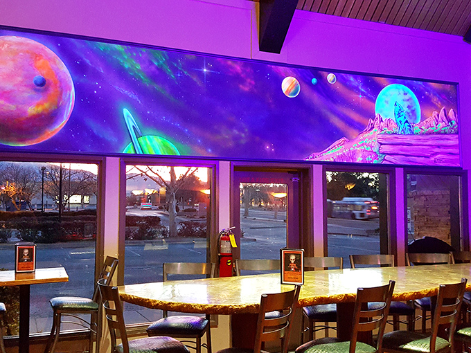 Looking out at Albuquerque through a window framed by a cosmic mural feels like viewing Earth from a particularly hospitable spaceship.