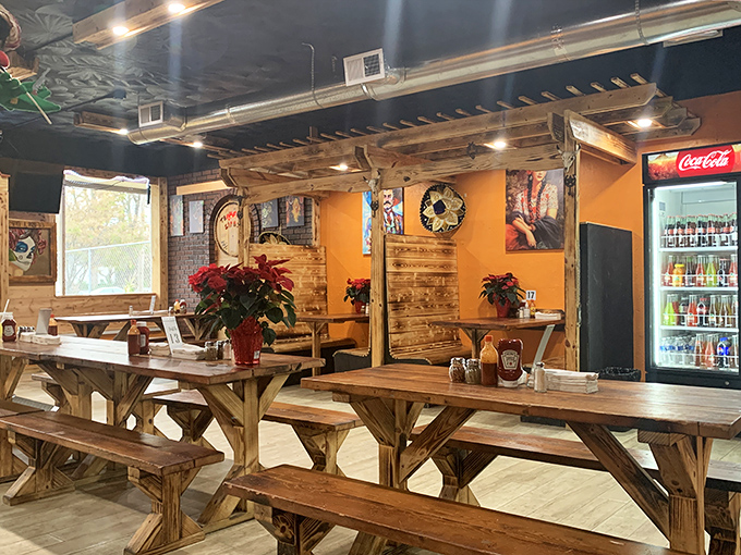 Rustic wooden picnic tables and warm lighting create the perfect backdrop for the serious business of taco consumption.