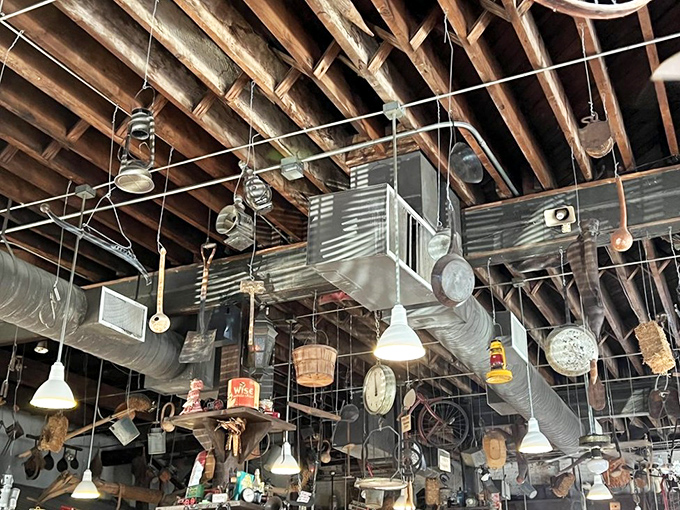The ceiling at Big Ed's isn't just decoration&mdash;it's a museum of Southern rural life, with everything from coffee tins to farm implements creating a one-of-a-kind dining backdrop.