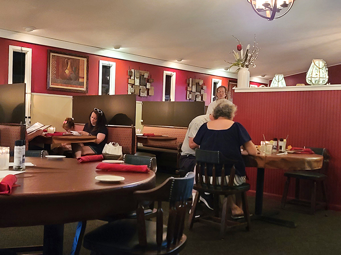 Red walls and warm lighting create the perfect backdrop for making memories over meals that matter.