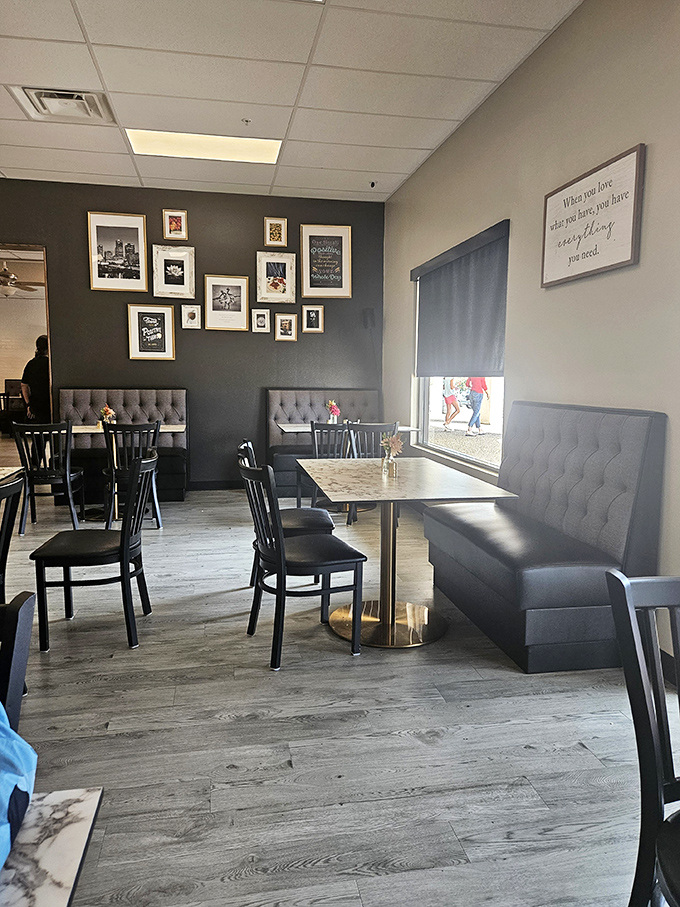 Modern meets cozy in this stylish dining section where the wall art reminds you that sometimes the best things in life come on a plate.