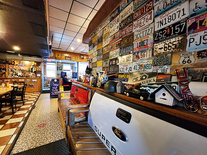 License plates from across America line the walls, silent witnesses to decades of road trips that found their perfect pit stop at Norma's counter.