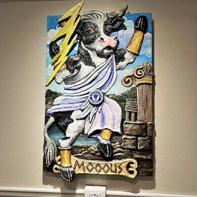 Wisconsin meets Mount Olympus in this whimsical wall art featuring a cow in Greek god attire. Zeus himself would approve of this dairy deity.