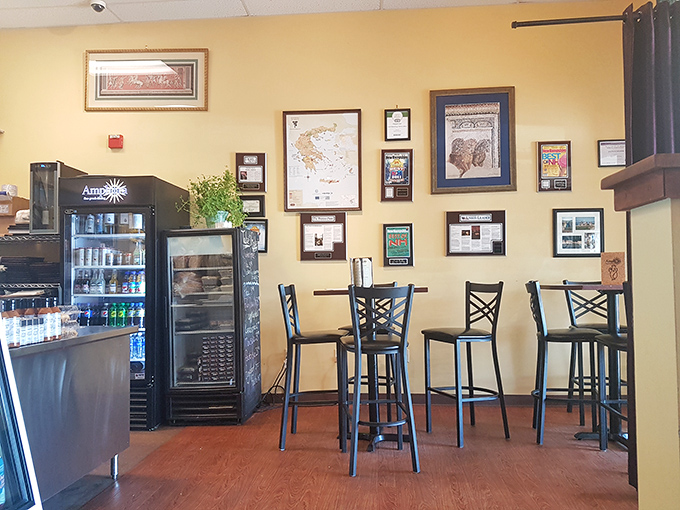 The wall of accolades tells stories of satisfied customers past, while high-top tables invite you to become part of the restaurant's ongoing history.