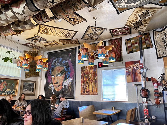 The ceiling adorned with Southwestern textiles and eclectic art creates a museum-like atmosphere where food and culture intertwine beautifully.