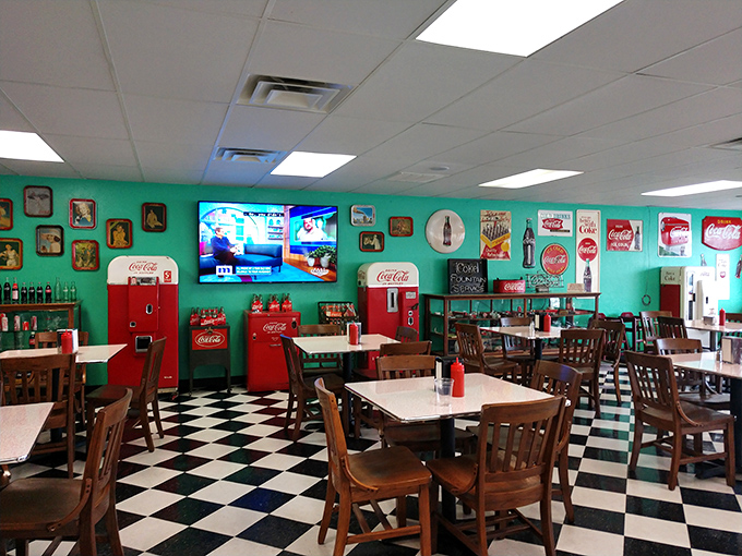 Coca-Cola collectibles and turquoise walls create the perfect backdrop for burger bliss. This isn't decoration—it's time travel.