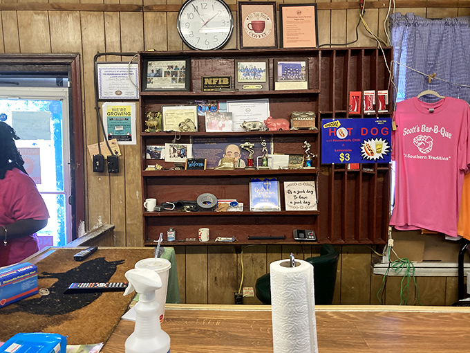 The wall of fame and merchandise corner&mdash;where barbecue legends are celebrated and t-shirts become souvenirs of your meat pilgrimage.