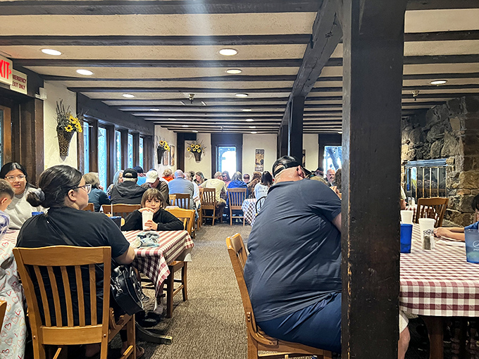 Where strangers become friends over shared appreciation of comfort food. The packed dining room hums with the universal language of "mmm."