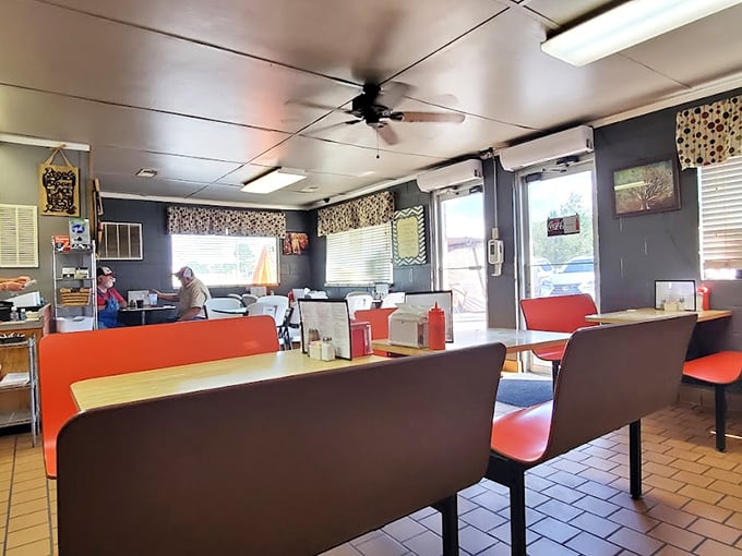Red booth seating and wooden tables create that perfect "everybody knows your name" vibe without trying too hard.