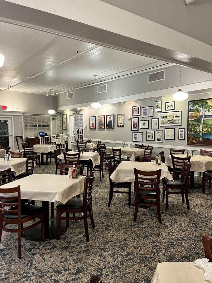 White tablecloths and wooden chairs—the stage is set for culinary theater where you're both audience and participant.