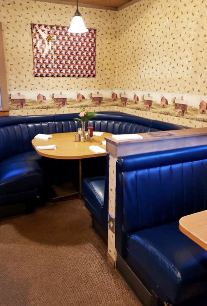 The blue vinyl booths have witnessed countless family celebrations, road trip pit stops, and first dates. If these seats could talk...