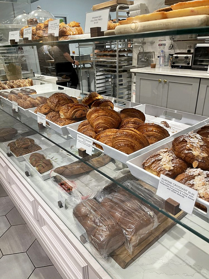Croissant heaven behind glass—where decisions become impossible and "I'll take one of each" becomes the only logical response.