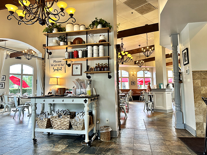 The entrance area manages to be both Pinterest-worthy and practical, with a "Please Wait to be Seated" sign that's more invitation than instruction.