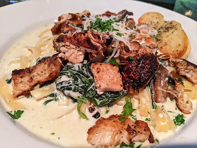 Fettuccine swimming in cream sauce with perfectly seared chicken. Carb-counters, look away&mdash;this is a pasta paradise worth the splurge.