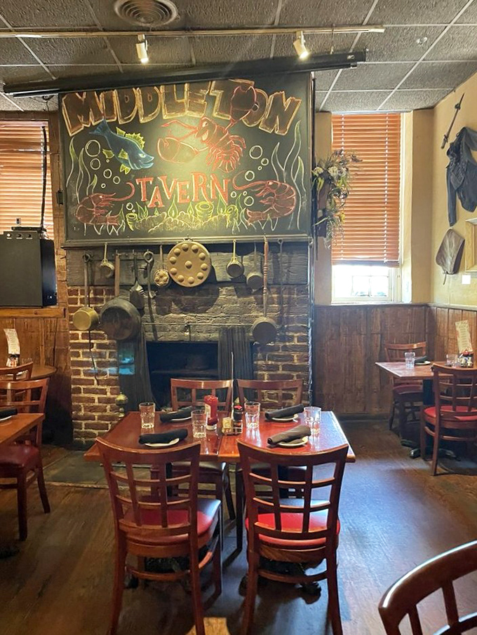The historic fireplace has witnessed centuries of dinner conversations. Those hanging pots could tell tales that would fill history books.