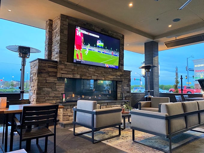 The lounge area offers a modern oasis where sports on TV and comfortable seating create the perfect pre-dinner gathering spot.