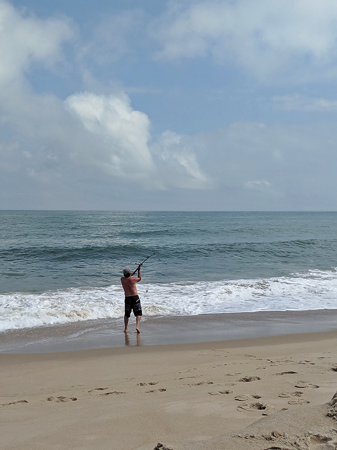 The timeless dance between angler and ocean. Some call it fishing; others call it standing in water holding a stick&mdash;both are right.
