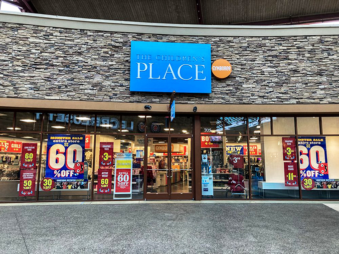 The Children's Place announces its sales with the subtlety of a carnival barker, because nothing says "bargain" quite like screaming red discount signs.