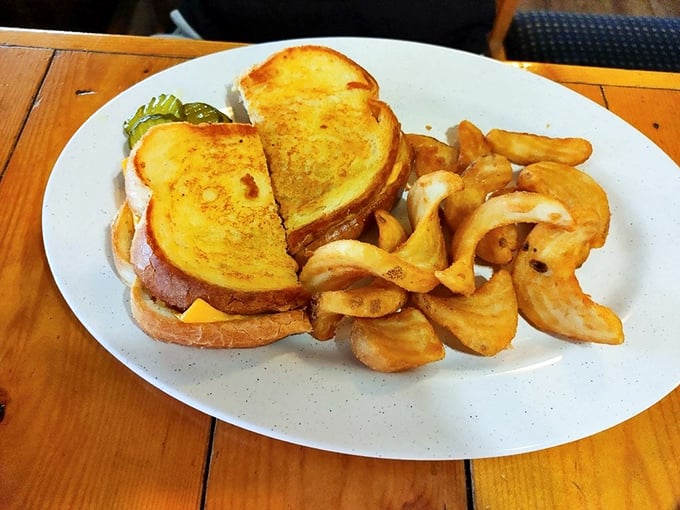 Grilled cheese that's achieved that perfect golden exterior while maintaining its gooey soul. Those sidewinder fries aren't just sides&mdash;they're accomplices to deliciousness.