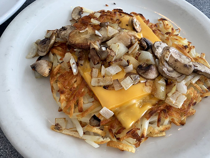 Hashbrowns topped with mushrooms, onions and melted cheese—the breakfast equivalent of hitting the jackpot.