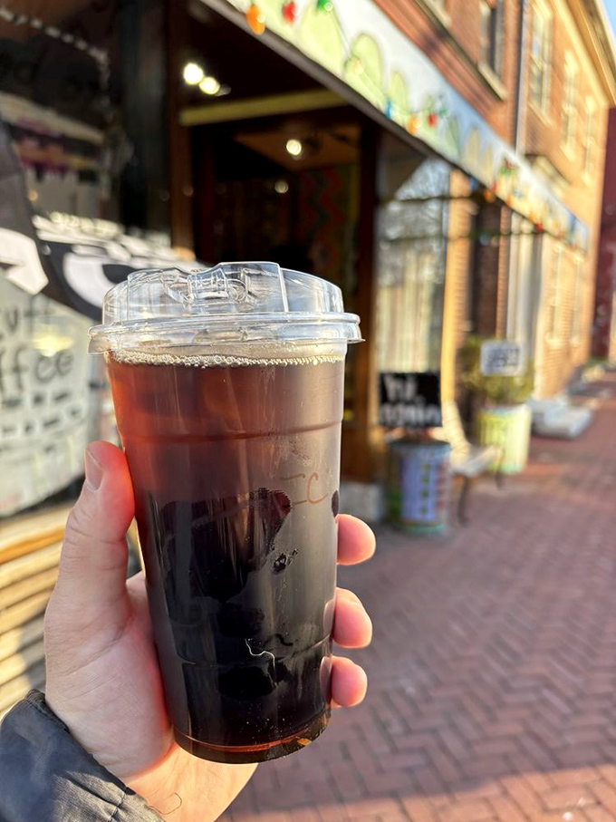 Iced coffee so dark and mysterious it could star in its own film noir. The brick sidewalk setting adds that perfect Kentucky charm.