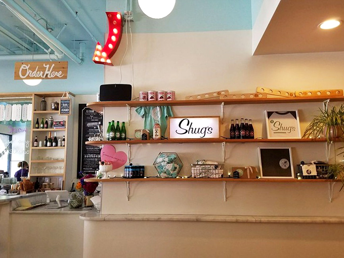 Shelves lined with bottles and treasures like a dessert apothecary. That "Order Here" sign might as well say "Happiness Begins Here."