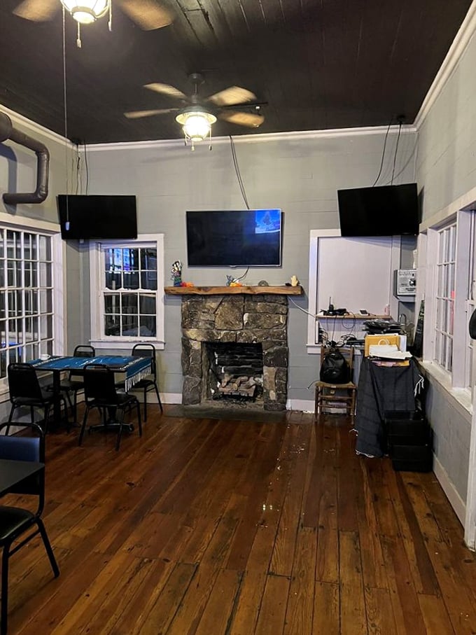 The stone fireplace and wooden floors add rustic charm to this dining room&mdash;like eating in a friend's cozy country home.