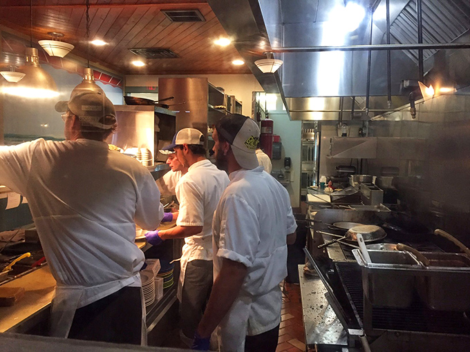 Behind the scenes, culinary choreography unfolds with the precision of a ballet and the heart of a home-cooked Sunday dinner.
